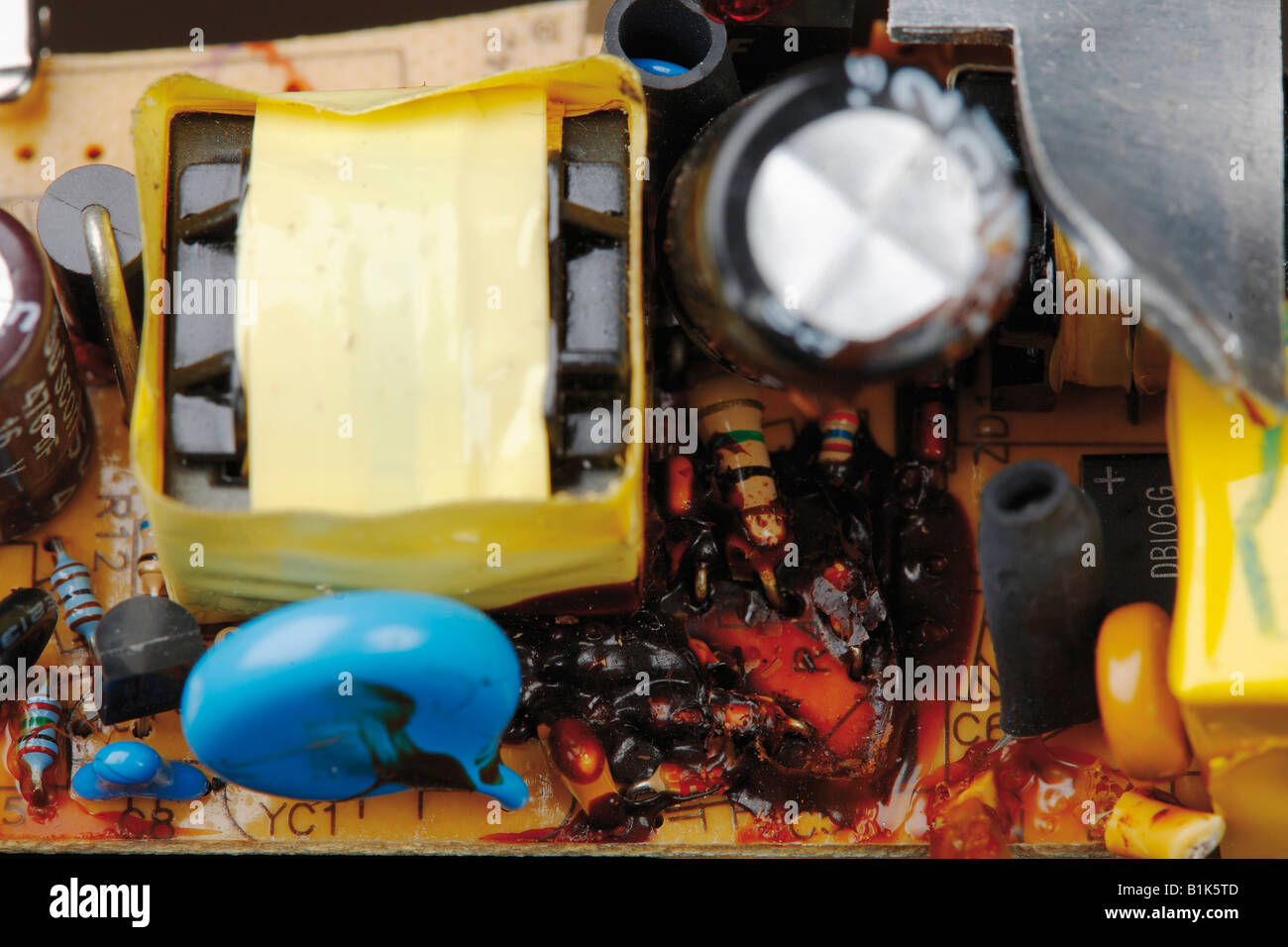 Broken circuit board with bursted capacitor Stock Photo - Alamy