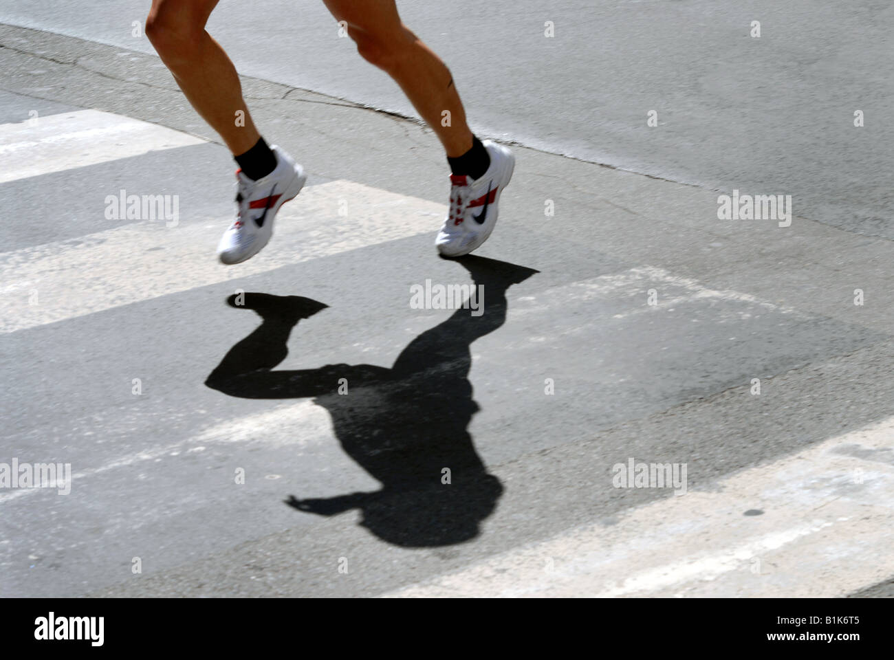 Running finish line silhouette hi-res stock photography and images - Alamy