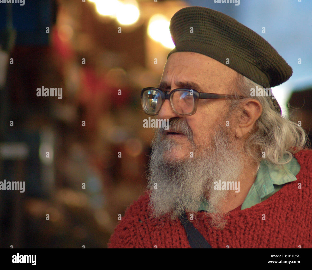 An elderly, bearded man makes his way through the Jewish Mahane Yehuda ...