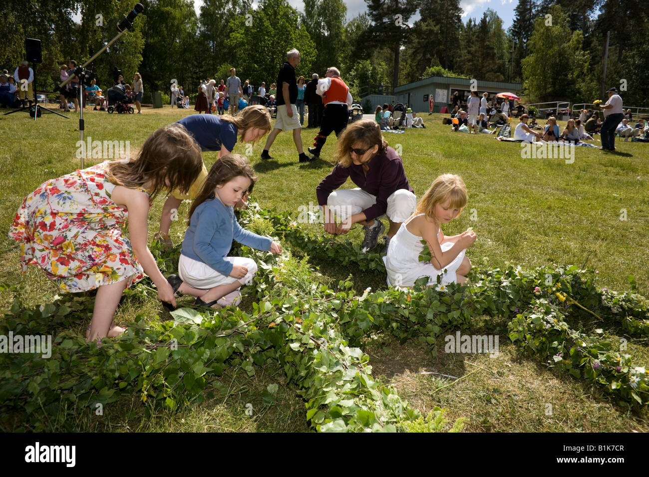 Decorating the Maypole at Midsummer (Sweden Stock Photo - Alamy
