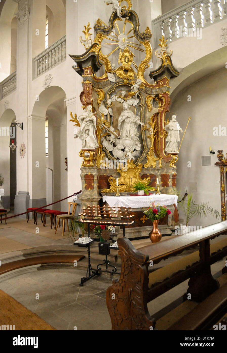 Small altar in the exquisitely decorated interior of Roman Catholic ...