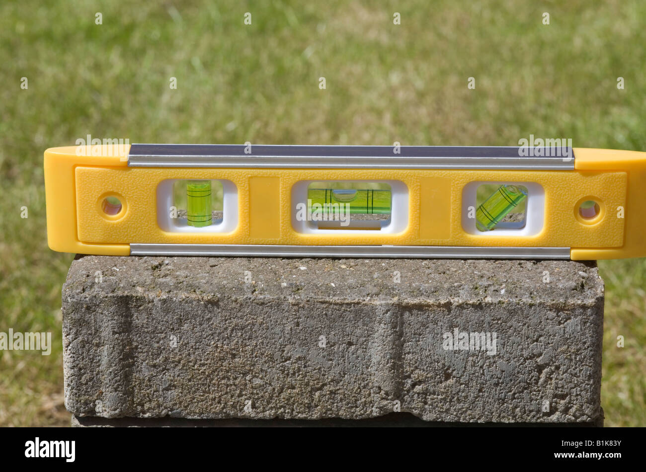 Studio Still Life Close up A yellow three directional spirit level on a ...