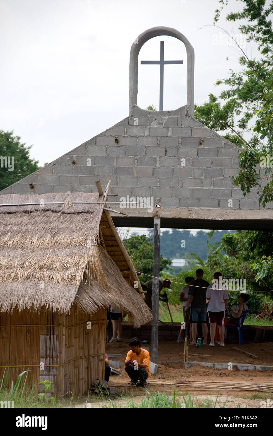 An old bamboo church in rural Thailand with a new church being built by ...