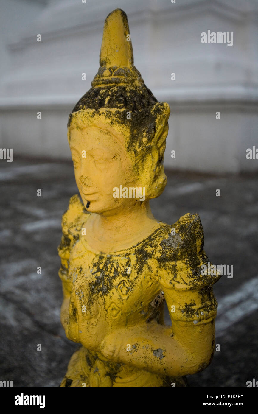 Aged yellow statue Stock Photo - Alamy