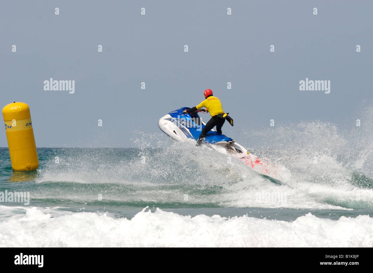 Lifeguard on a jet ski during Zapcat racing at Watergate Bay, Cornwall ...