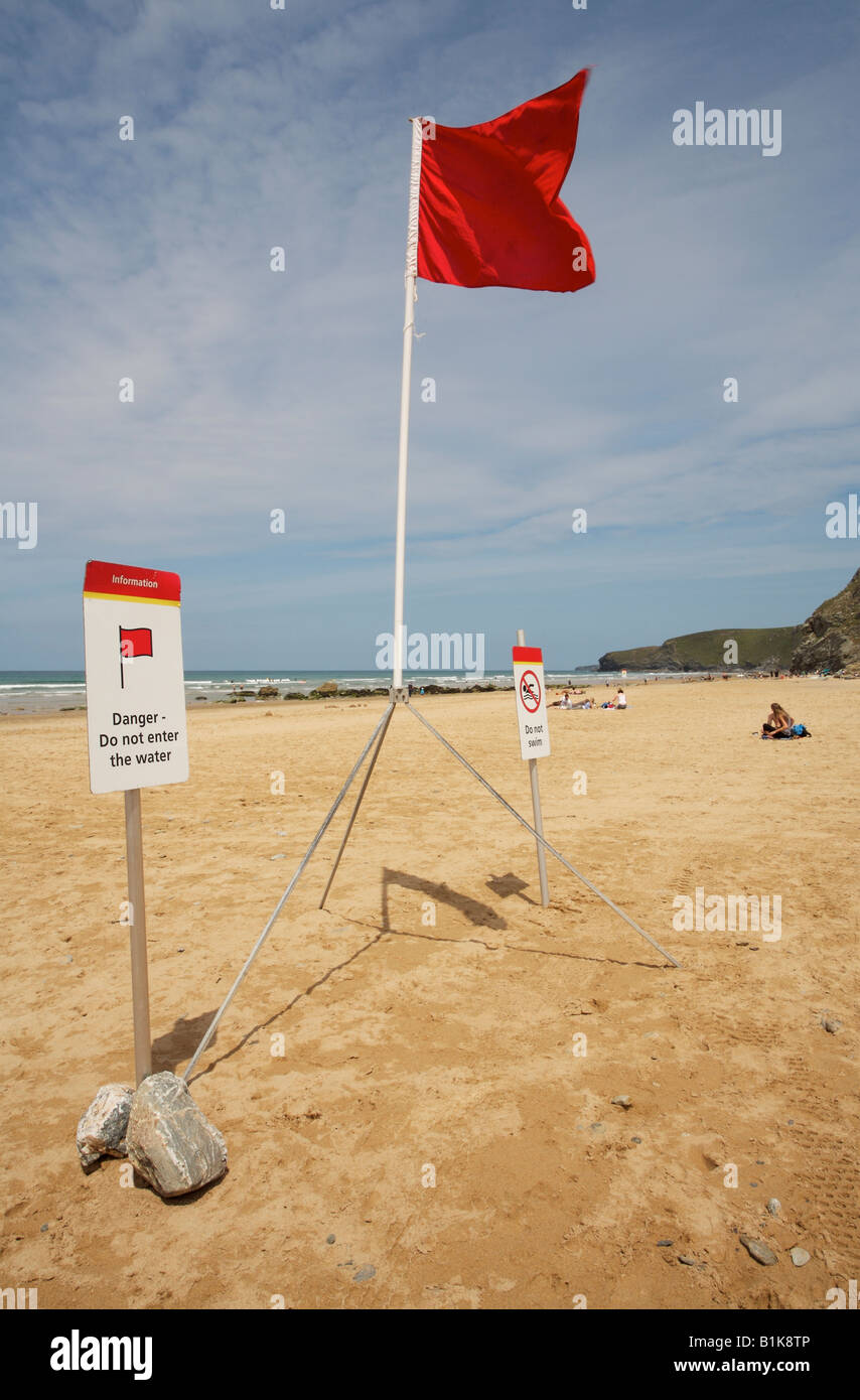 Lifeguards' red warning flag on beach at Watergate Bay, north Cornwall ...