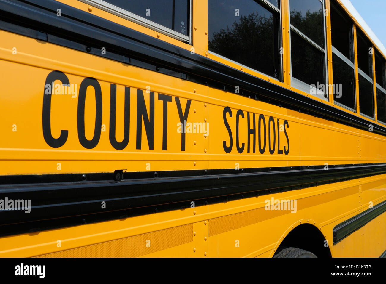 Side of A yellow public school bus for the county school system Stock ...