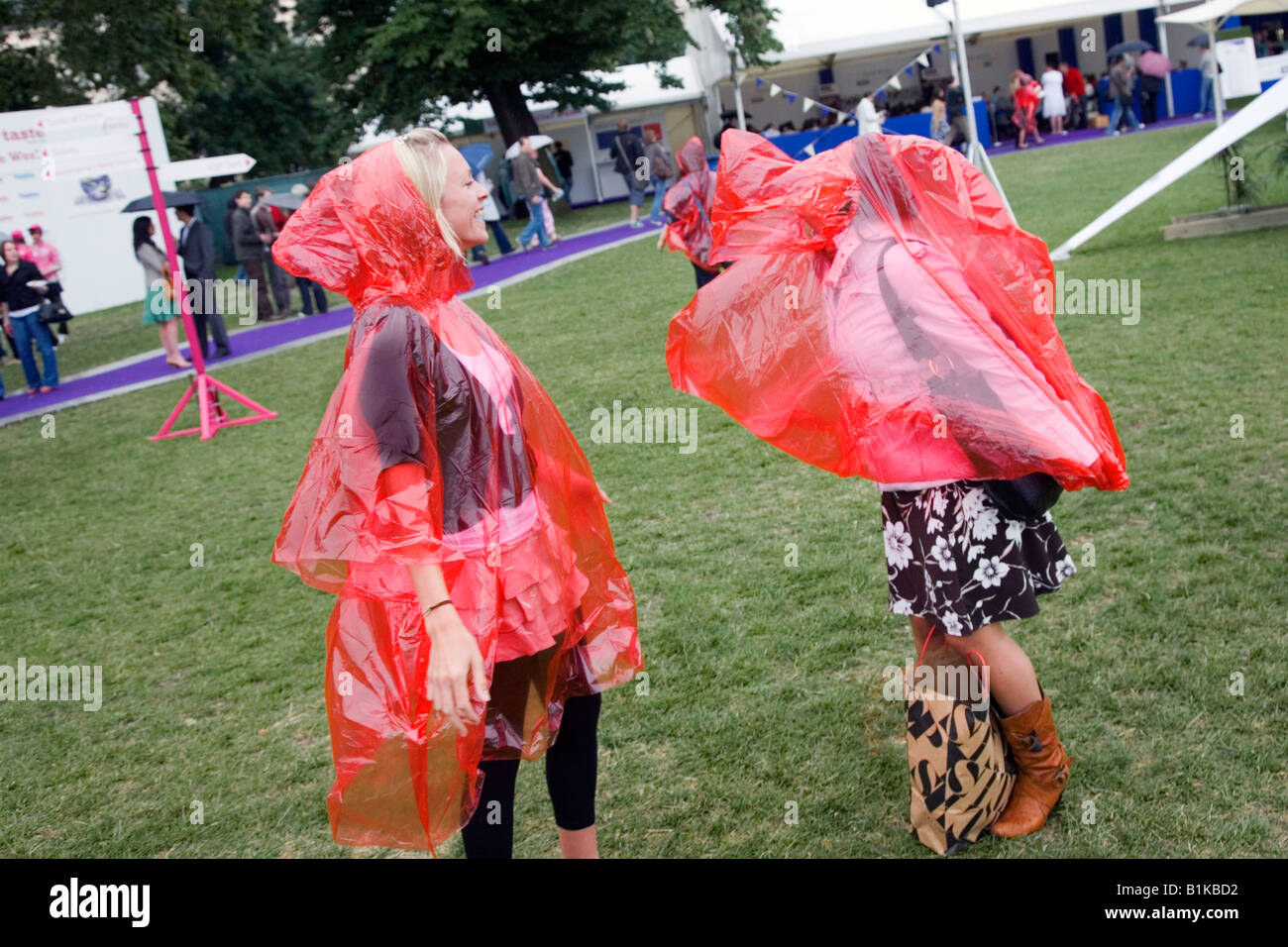 putting on rain protectors in London Stock Photo - Alamy