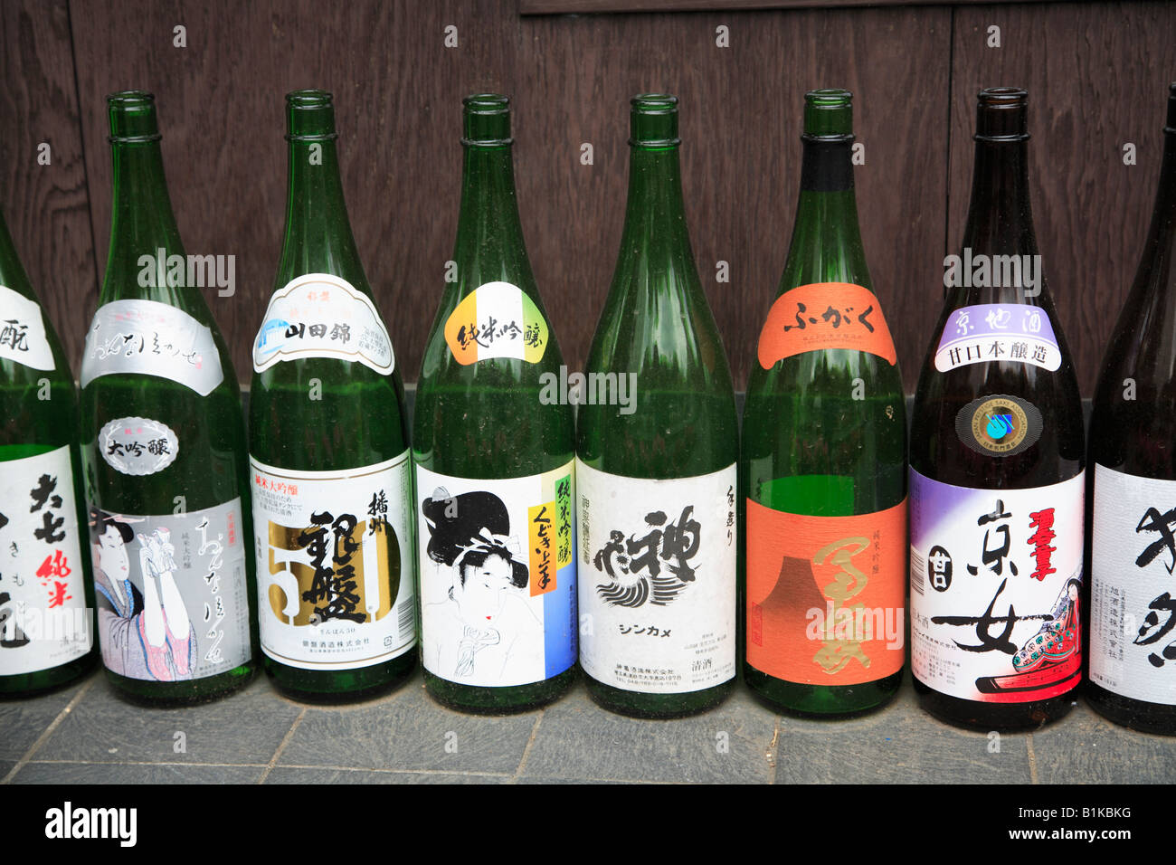 Saki bottles on display outside restaurant in Tokyo Japan Stock Photo ...