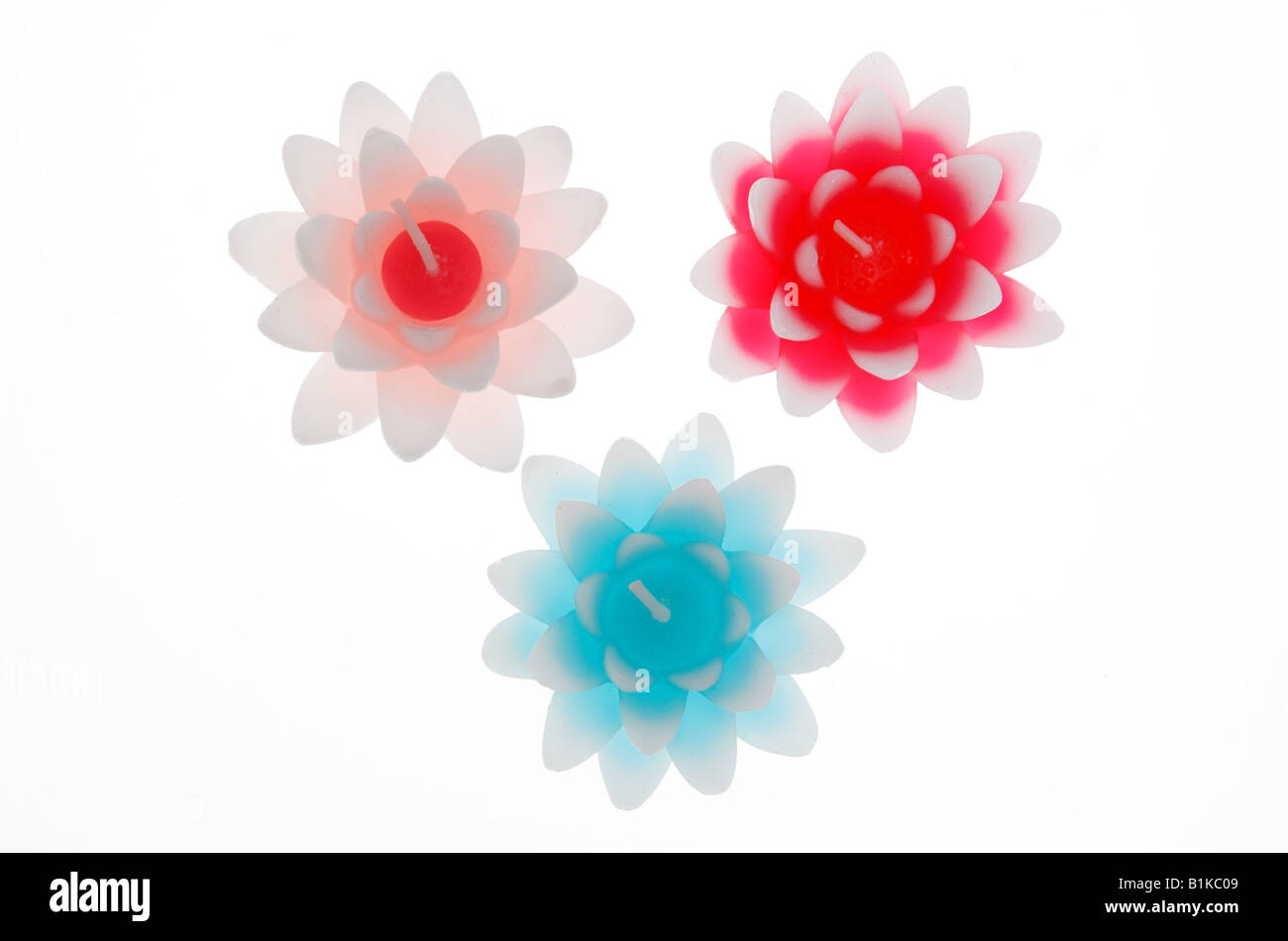 trio of floating candles white red and blue Stock Photo - Alamy