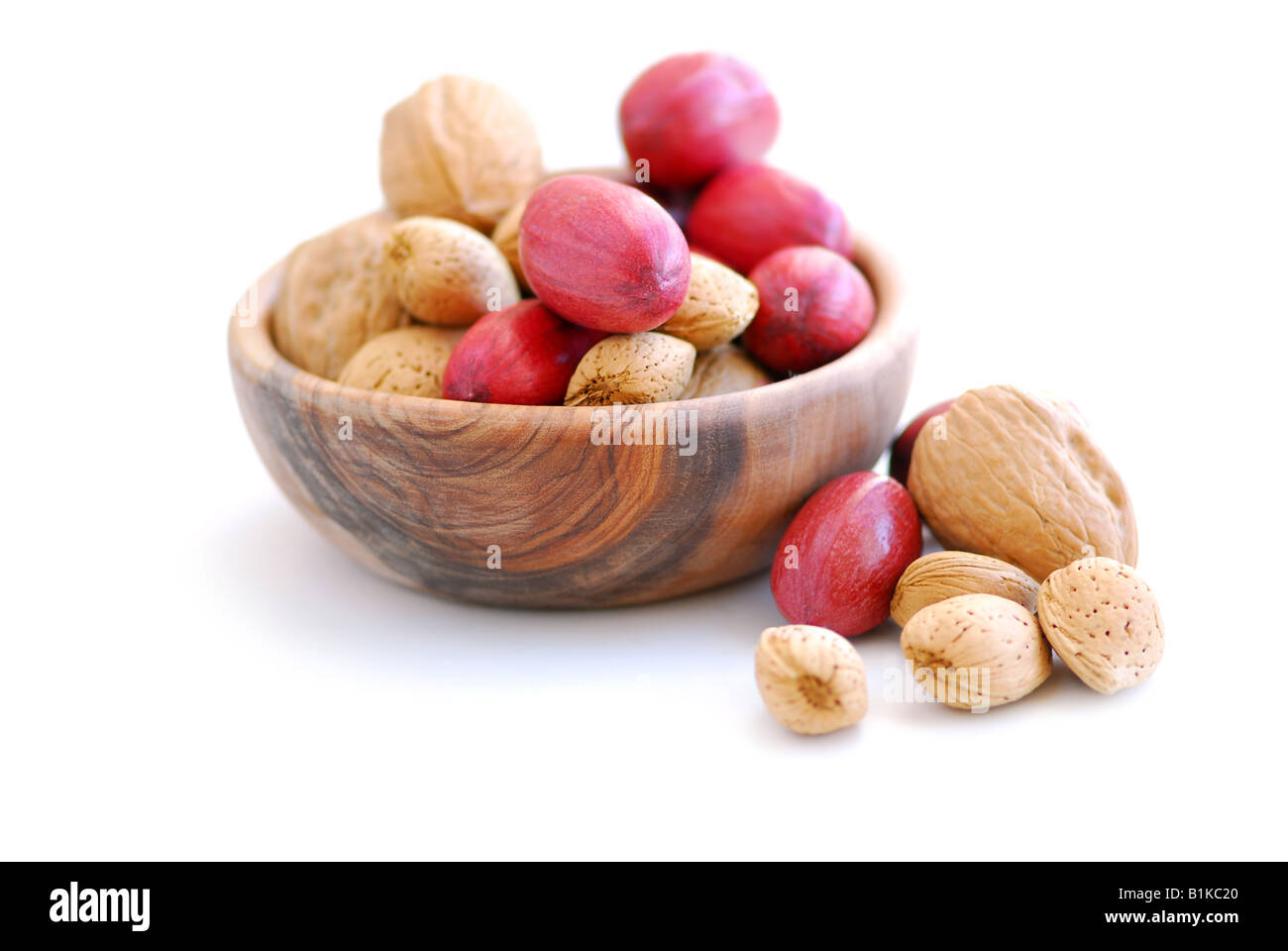Assorted whole nuts walnuts pecans almonds isolated on white background ...