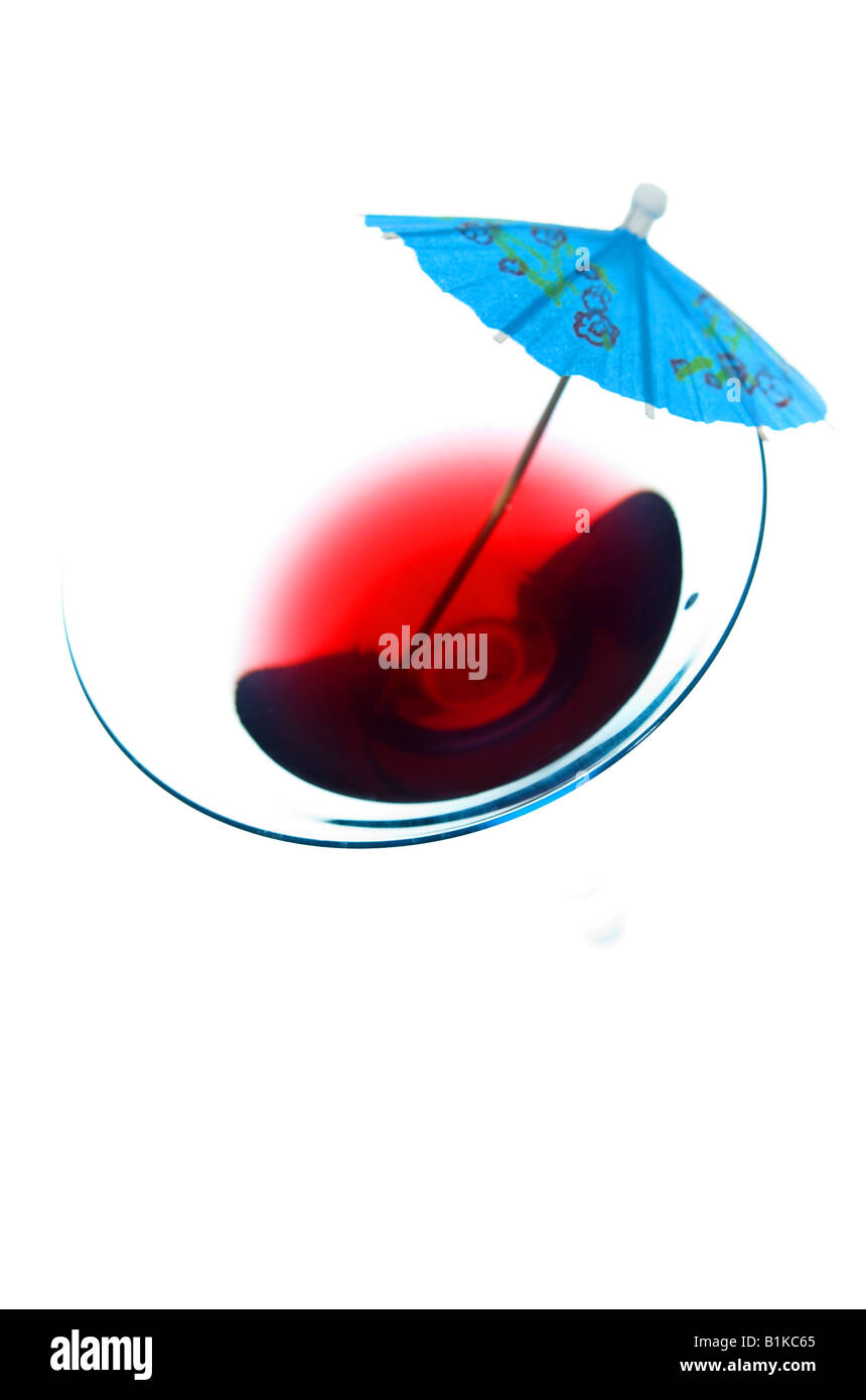 overhead of cocktail in blue glass with fun umbrella Stock Photo - Alamy