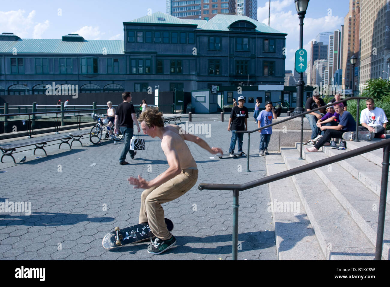 A skateboarder lands after attempting an airwalk grab off a set of ...