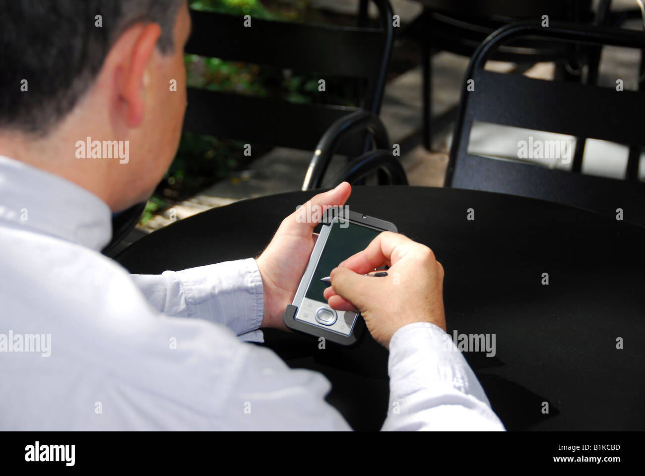 Businessman holding a pda Stock Photo - Alamy