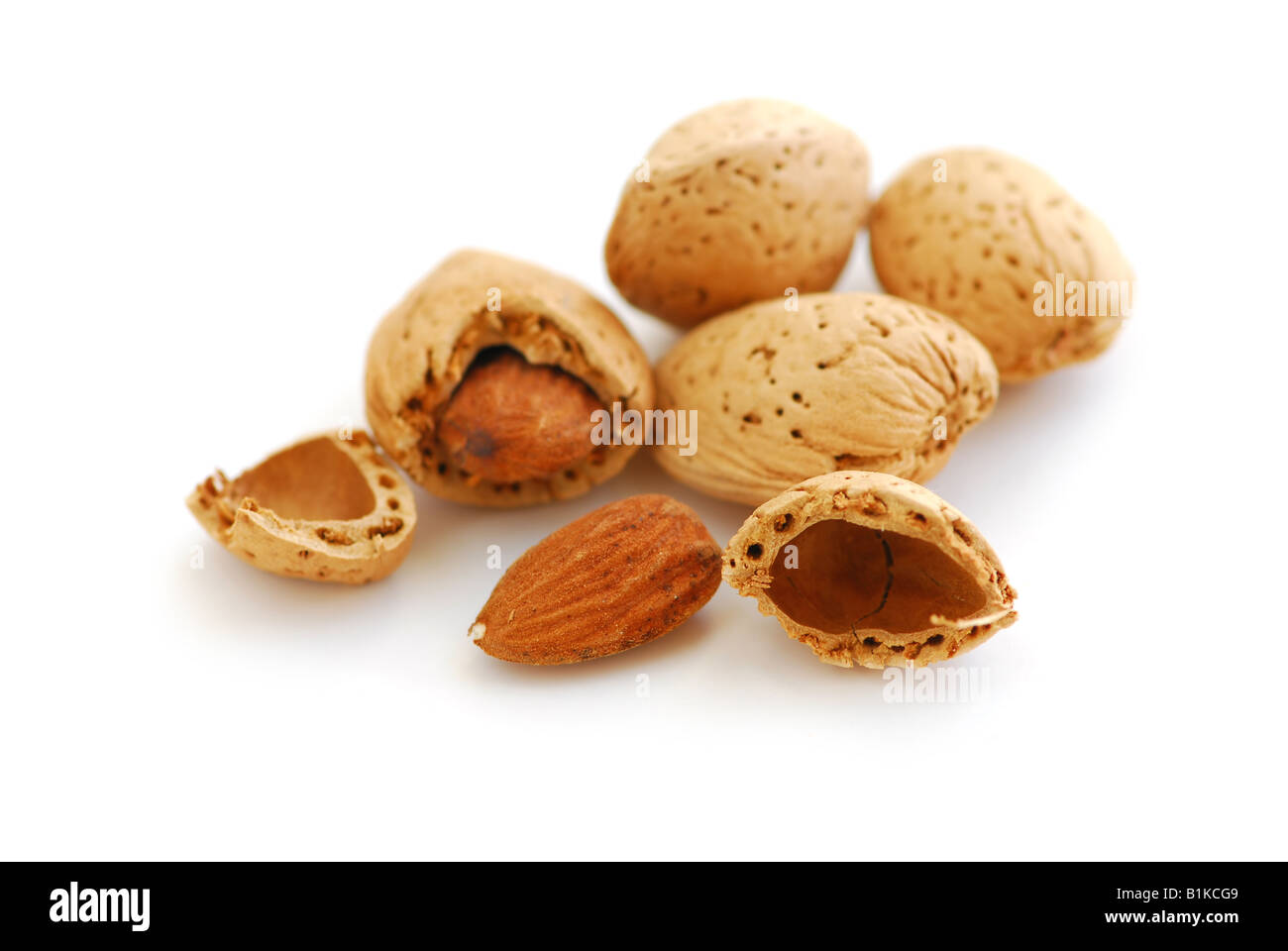 Almonds close up isolated on white background Stock Photo - Alamy