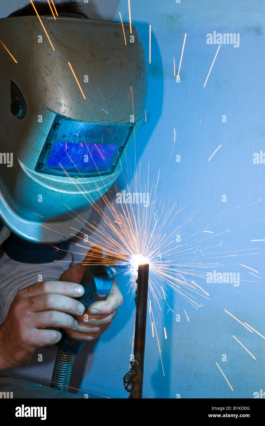 welder at work with safety mask Stock Photo - Alamy