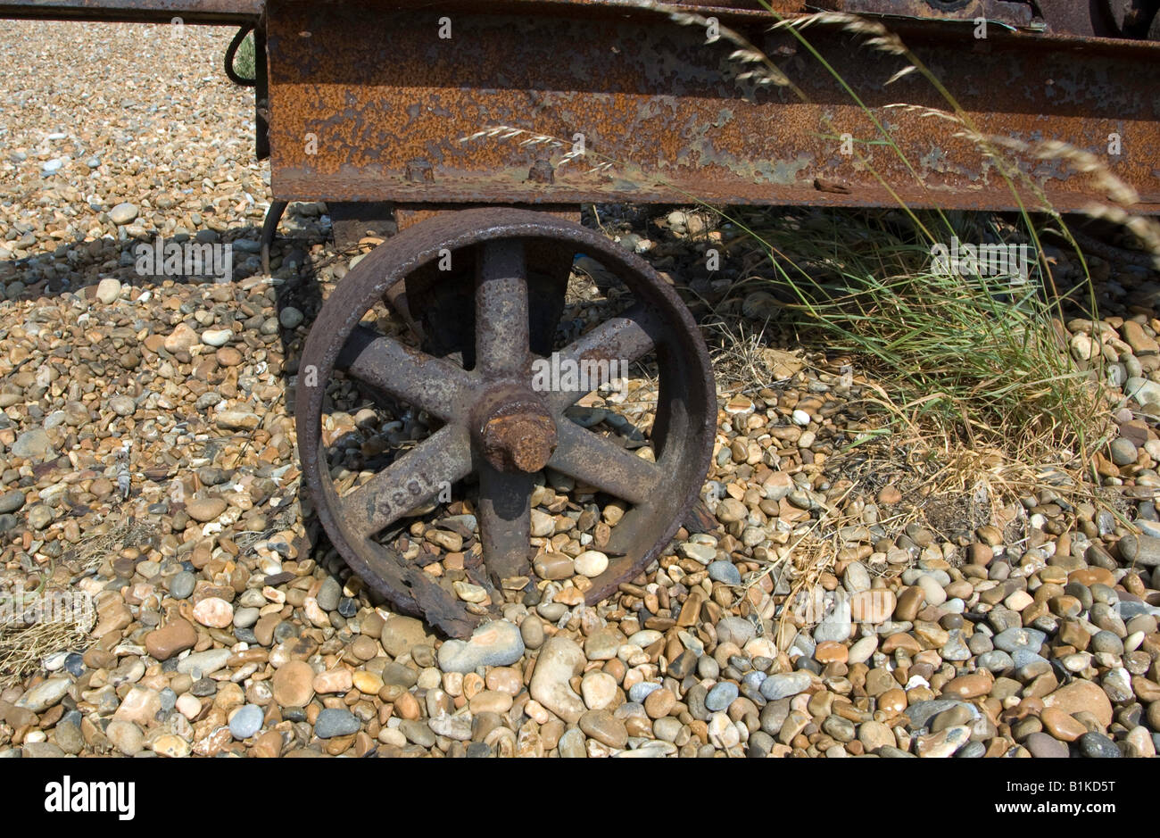 Detail of rusting wheel on Shingle Street beach, Suffolk Stock Photo - Alamy
