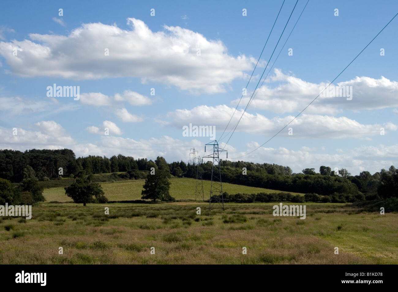 Electricity pylons across the Countryside Stock Photo - Alamy