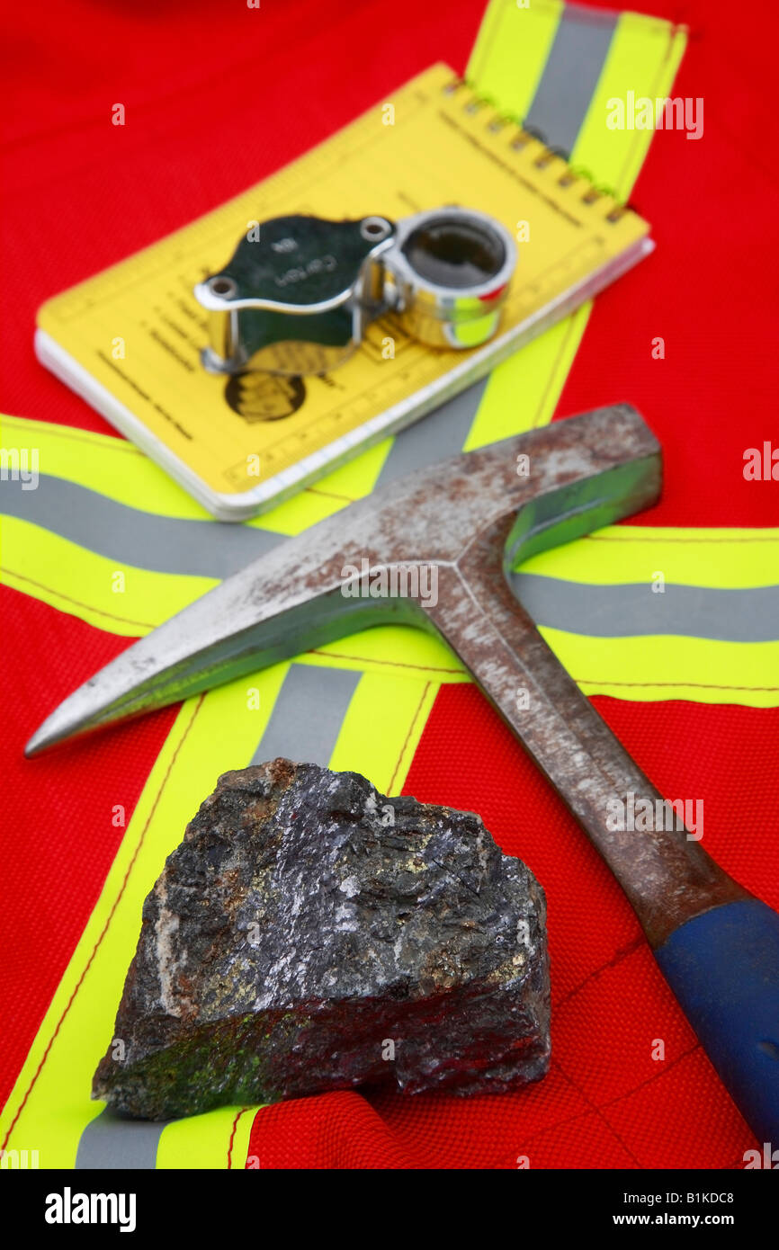 Mining concept of ore sample, geologists rock hammer ,magnifier and ...