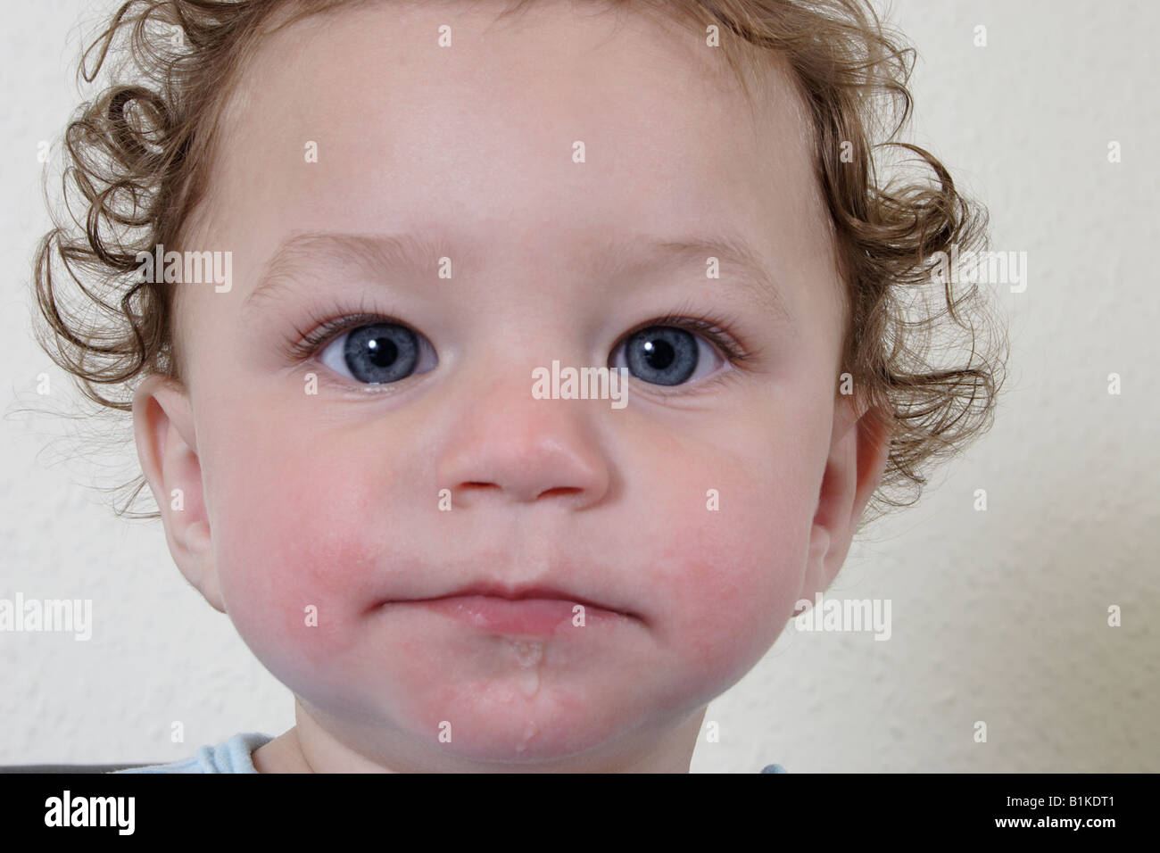 portrait little baby with curly hair Stock Photo - Alamy