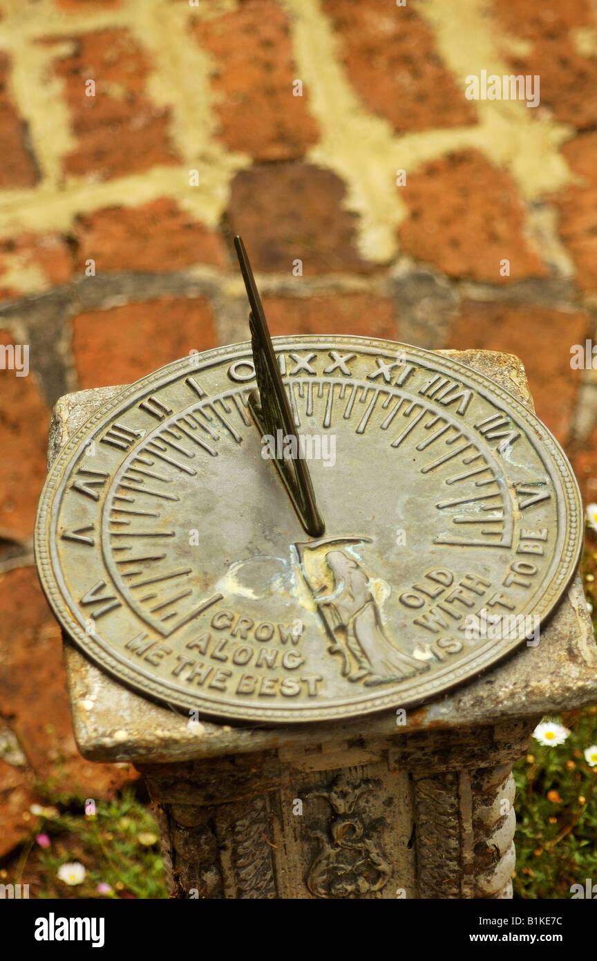 Sundial, with brick background Stock Photo - Alamy