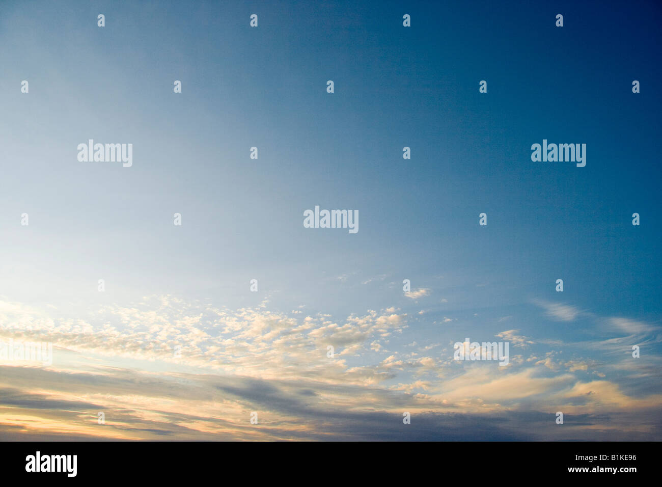 A dramatic blue sky and clouds at sunset Stock Photo - Alamy