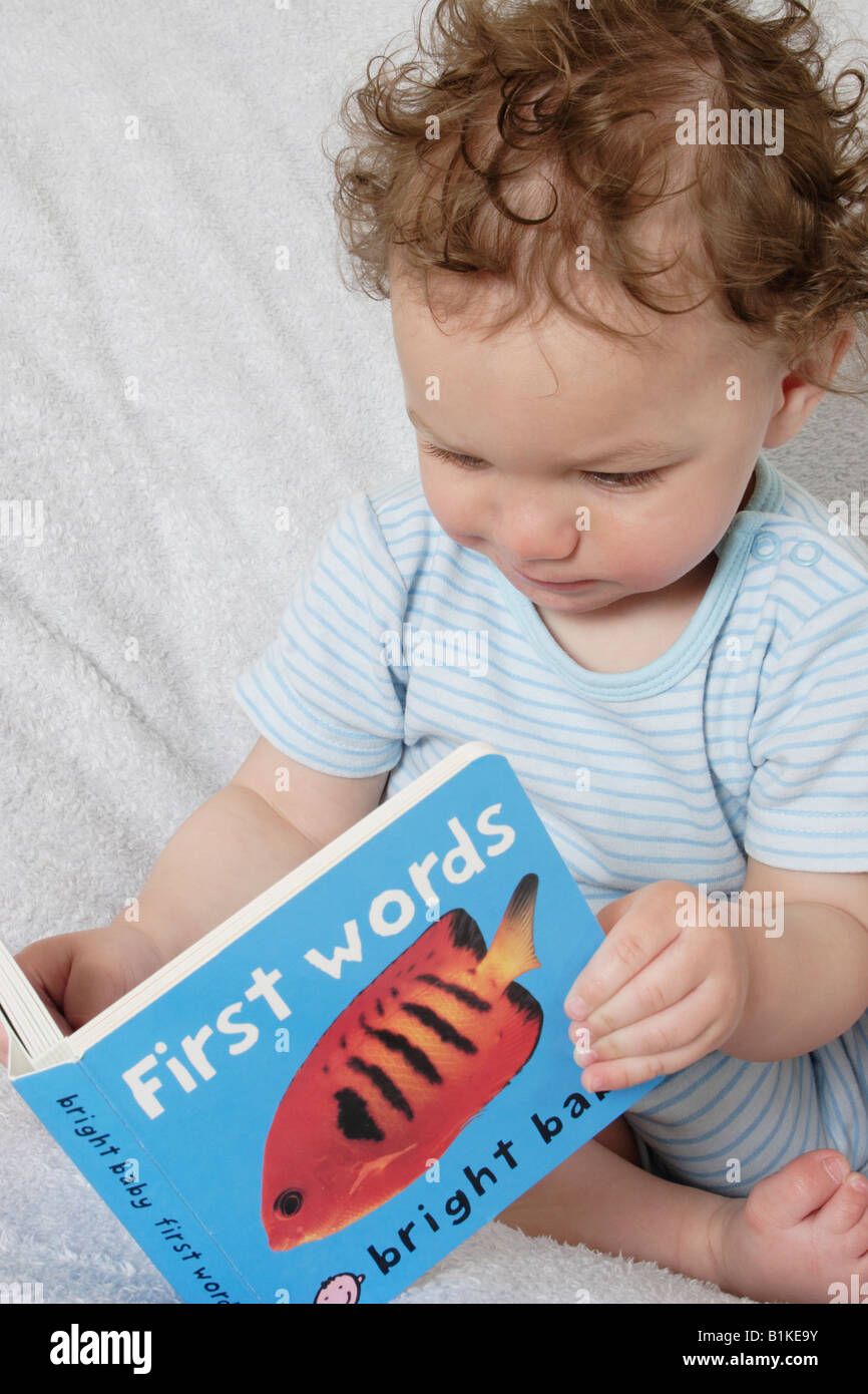little baby reading book of first words Stock Photo - Alamy
