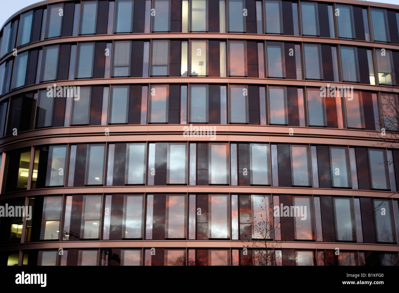 Glassy facade of a office building with sky reflection in Hamburg ...