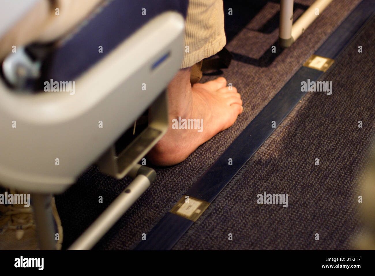 Man's bare feet on a plane, view from above Stock Photo - Alamy