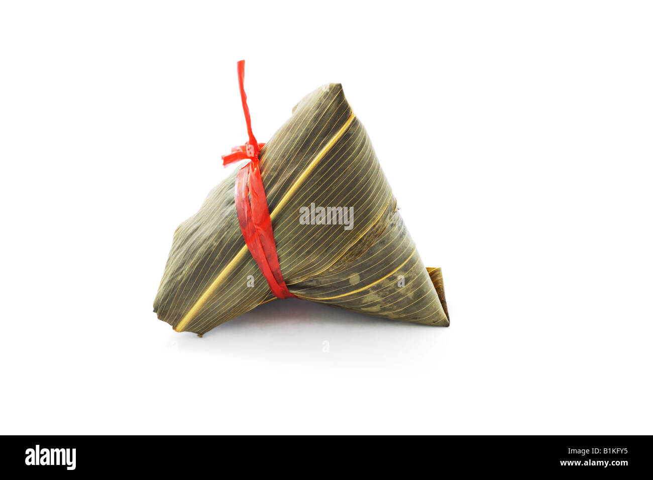 Chinese rice dumpling with bamboo leaves wrapping Stock Photo - Alamy