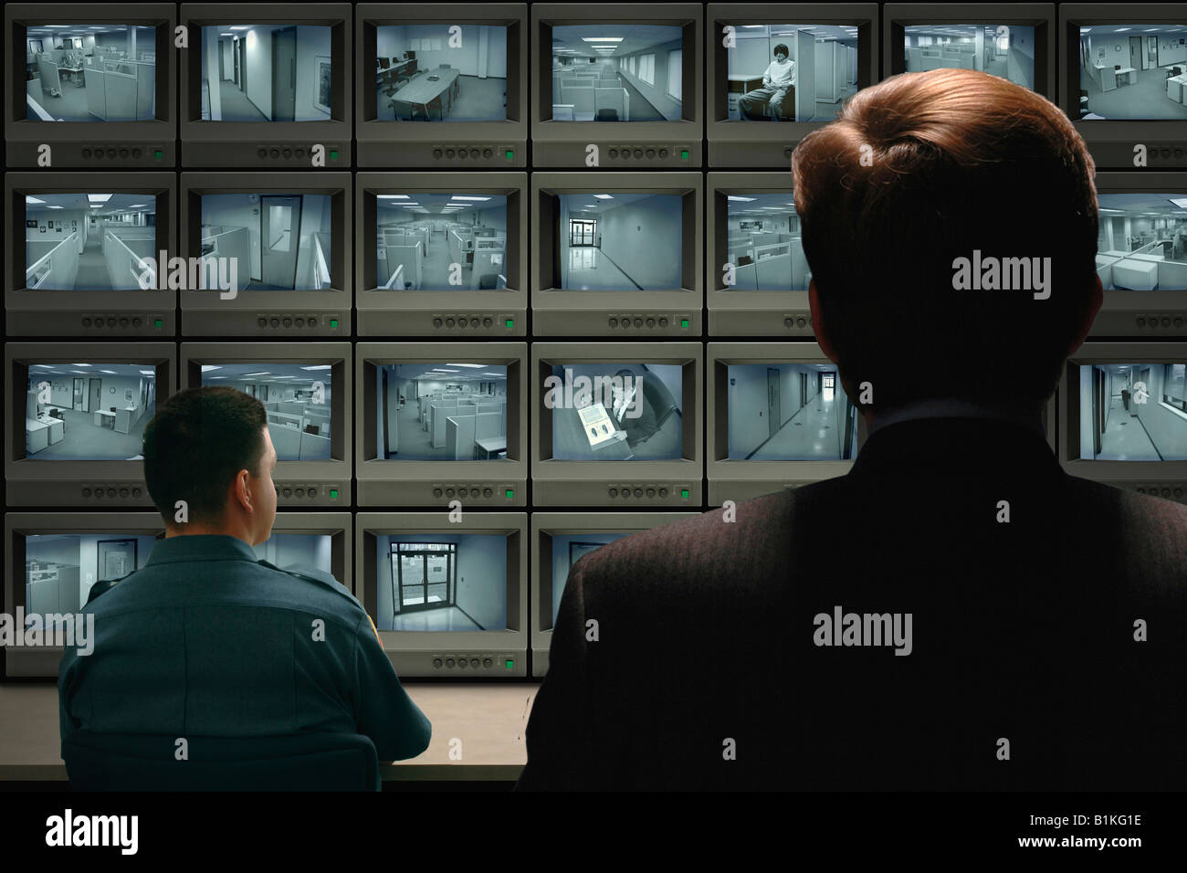 Corporate security center observing employees via video surveillance ...