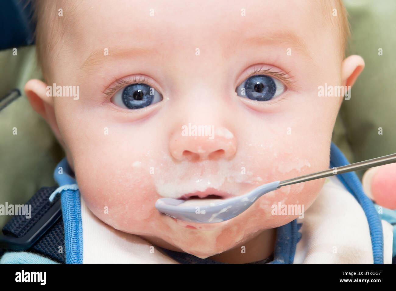 Mommy feeding baby warm cereal Stock Photo - Alamy