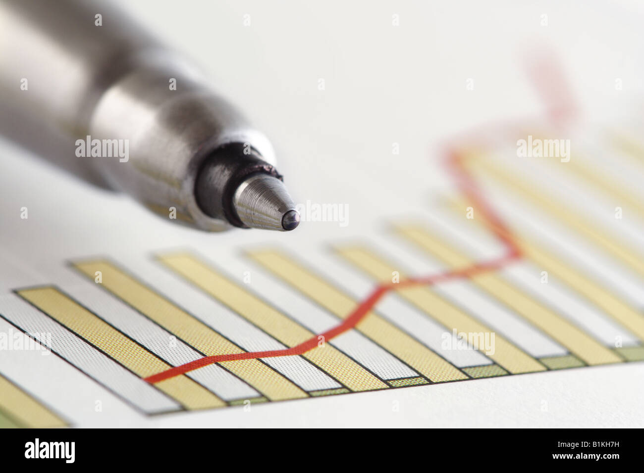 Pen on Positive Earning Graph Stock Photo - Alamy