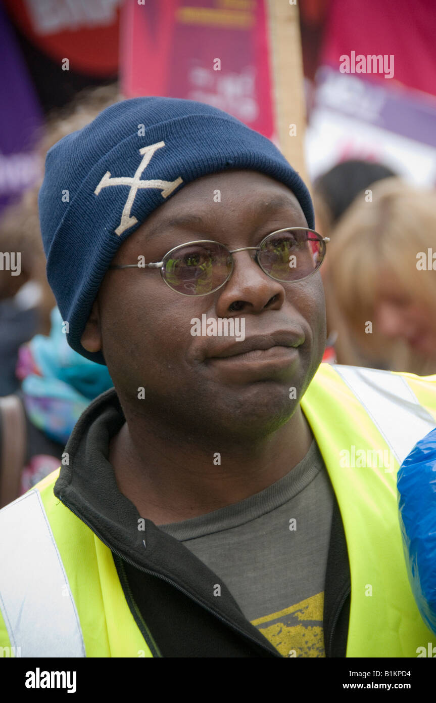 Black steward with cross on hat at head of 'Stop the BNP' Love Music ...