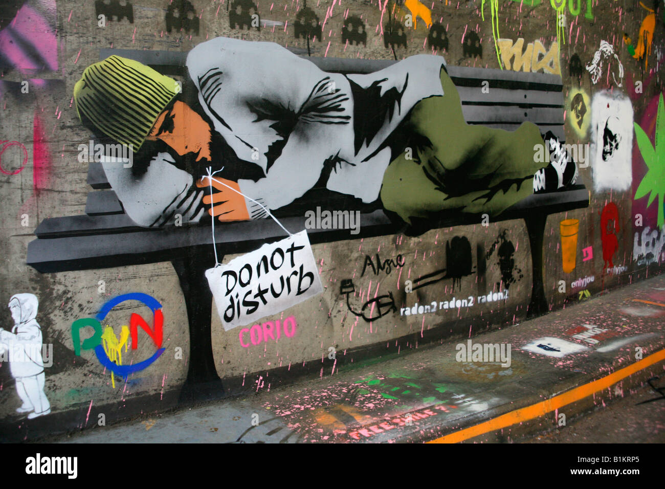 Do Not Disturb sign on graffiti of tramp at Leake Street, Waterloo ...