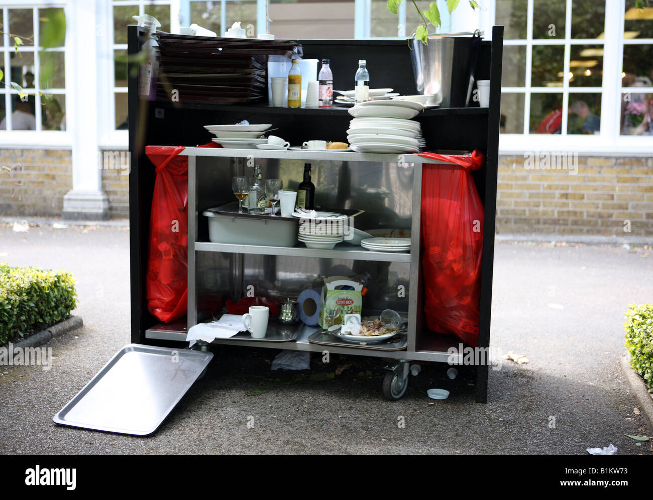 Overloaded food trolley, with discarded food Stock Photo - Alamy