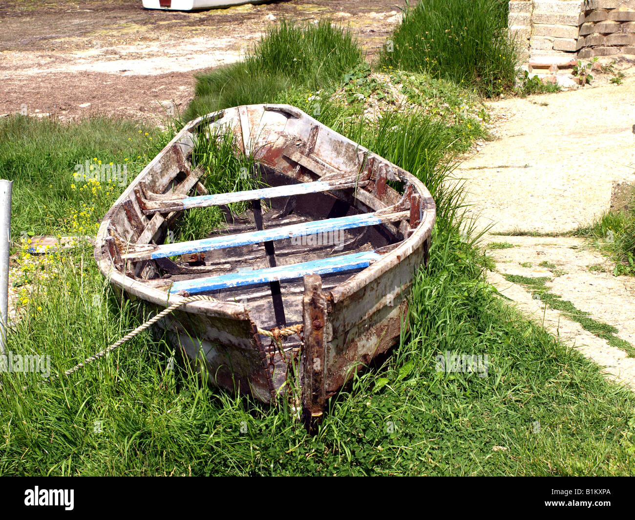 An old rotting boat called a "Fleet trow"left,to,decay with grass ...