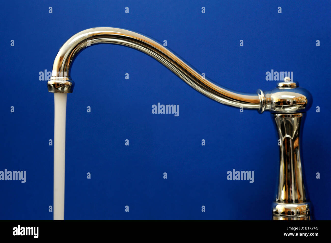Water flowing from water faucet Stock Photo - Alamy