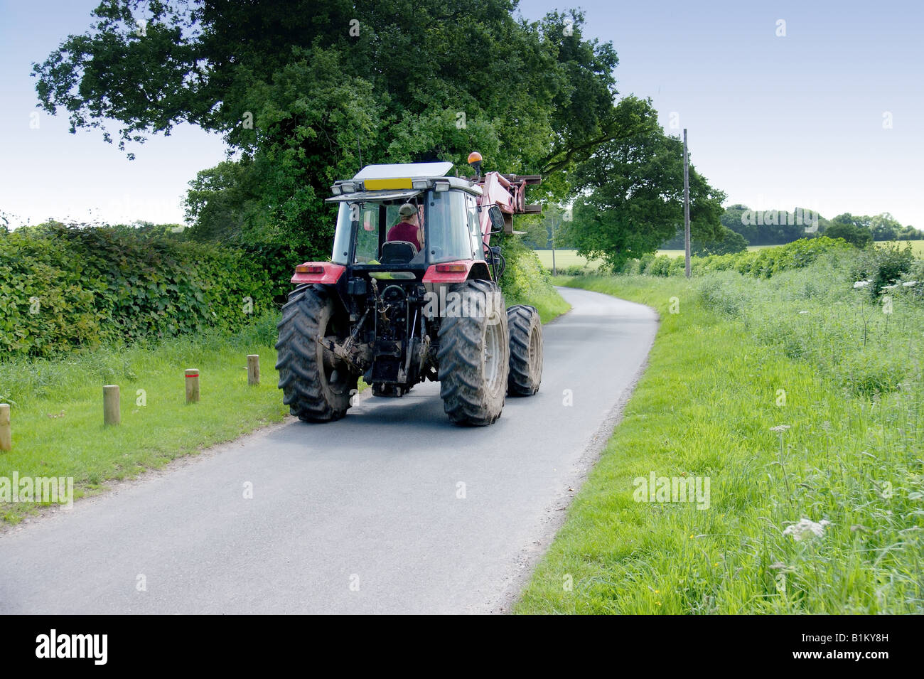 a tractor on a country lane Stock Photo - Alamy