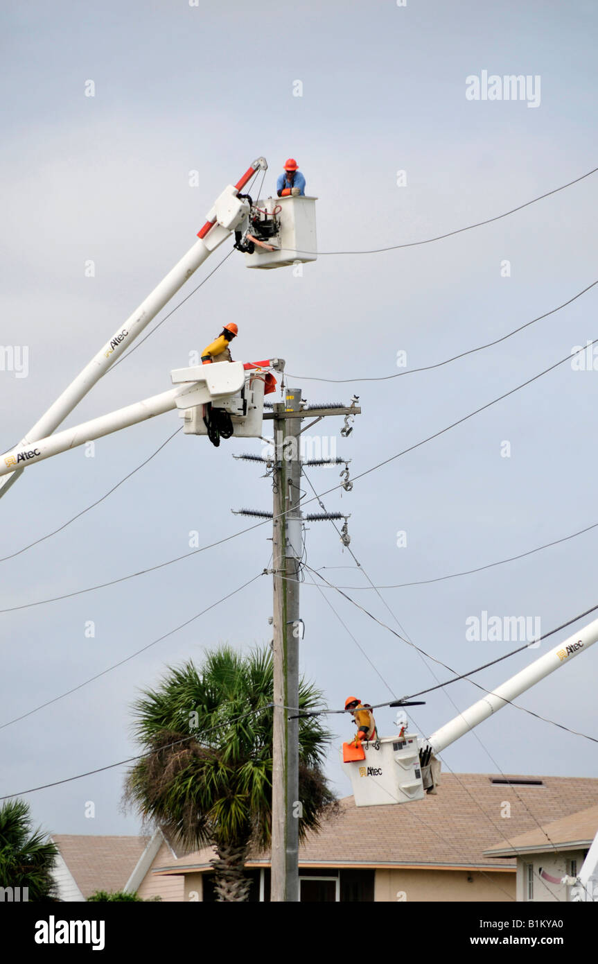 Workers install high tension electrical power lines Lakeland Florida ...