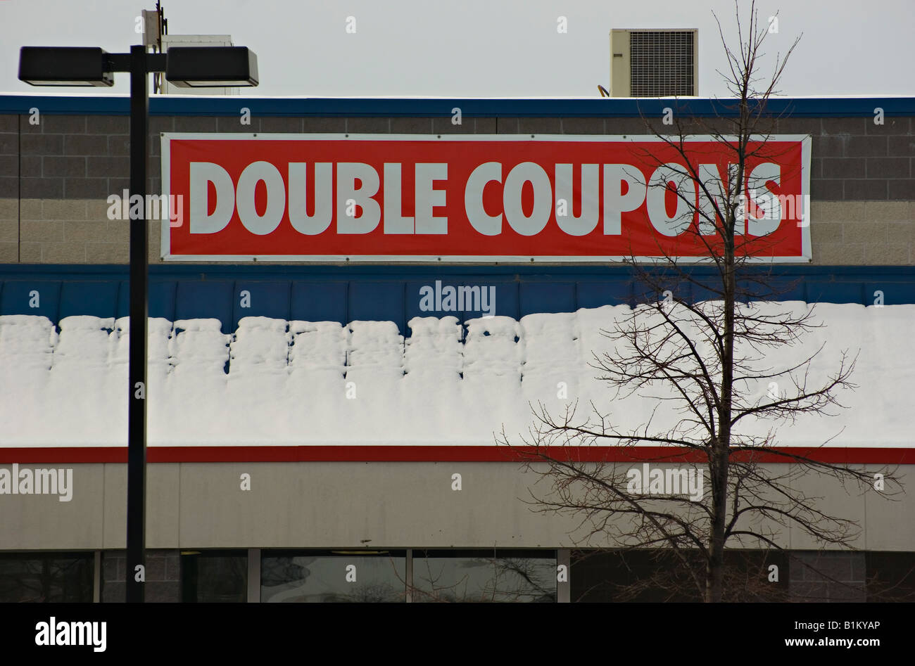 Huge double coupon sign on supermarket indicative of rising prices and ...