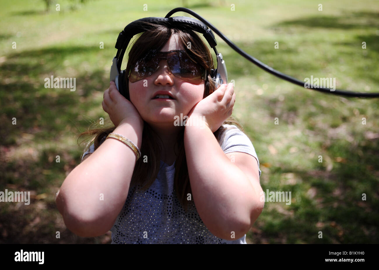 Young girls and a boy listening to trees, and all the sounds they make ...