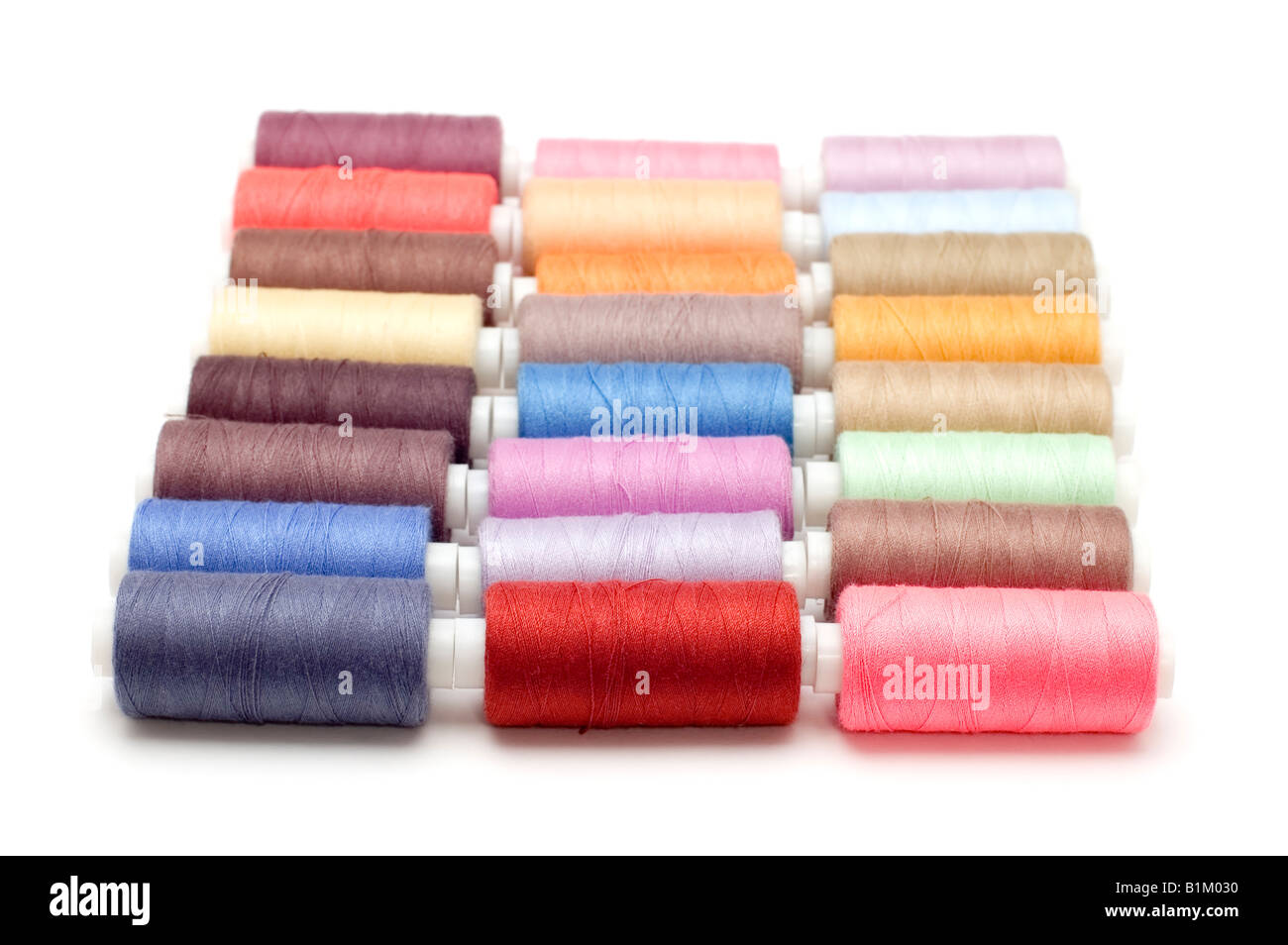 object on white sewing cotton rolls Stock Photo - Alamy