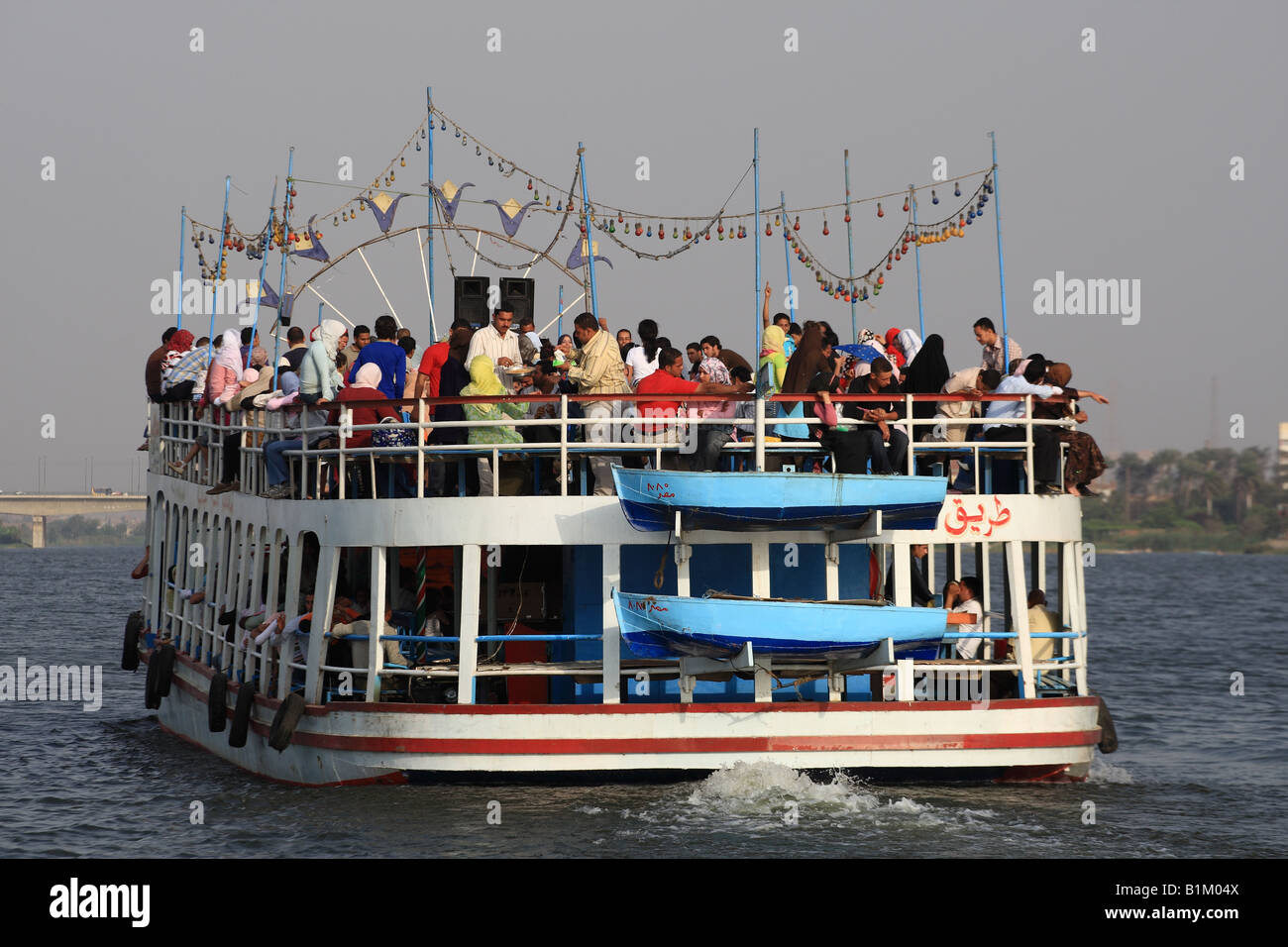 Young Egyptian hire a river boat and make party on it.Nile river cruise ...