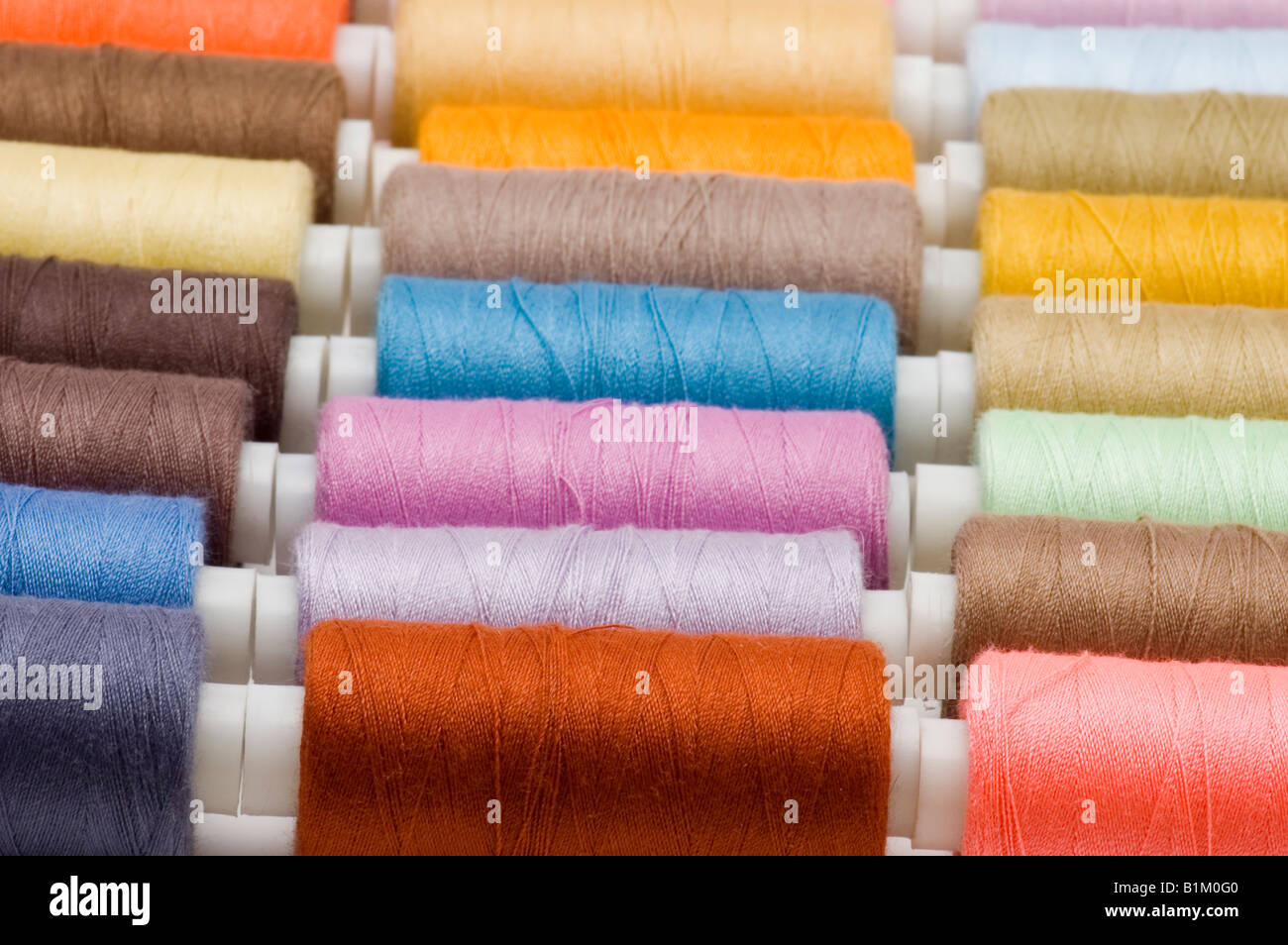 object on white sewing cotton rolls Stock Photo - Alamy