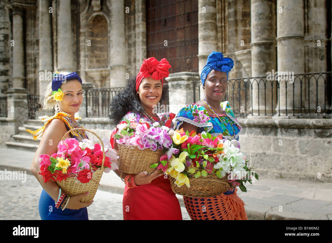 Traditionally Dressed Cuban flower womenin Havana Stock Photo - Alamy