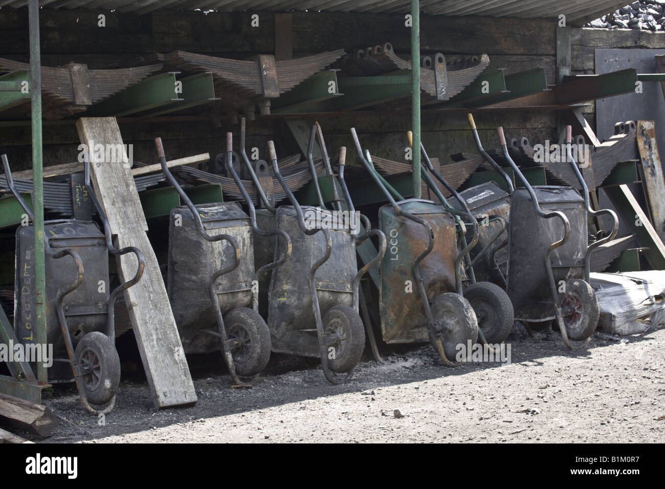 wheelbarrows in a row Stock Photo - Alamy