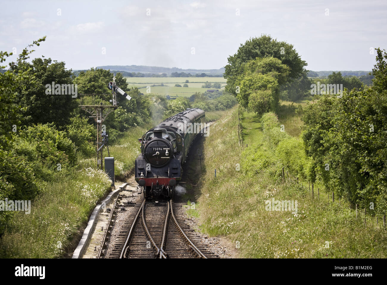 Steam Train and Engineer Driver Stock Photo - Alamy