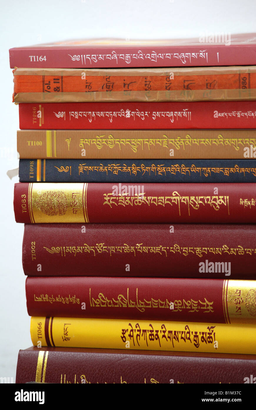 Pile of Tibetan language books Stock Photo - Alamy