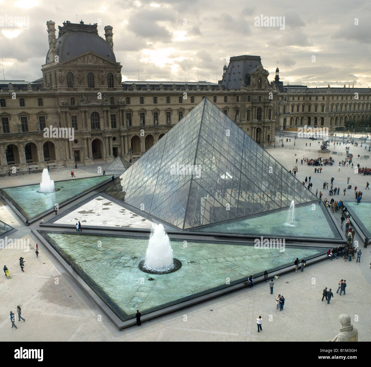 Courtyard and glass pyramid of the Louvre Museum in Paris France Stock ...
